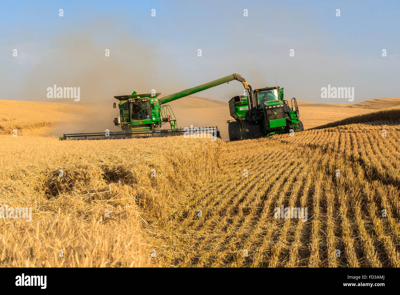 John Deere Combine Harvesting Wheat John Deere Combine Harvesting Wheat