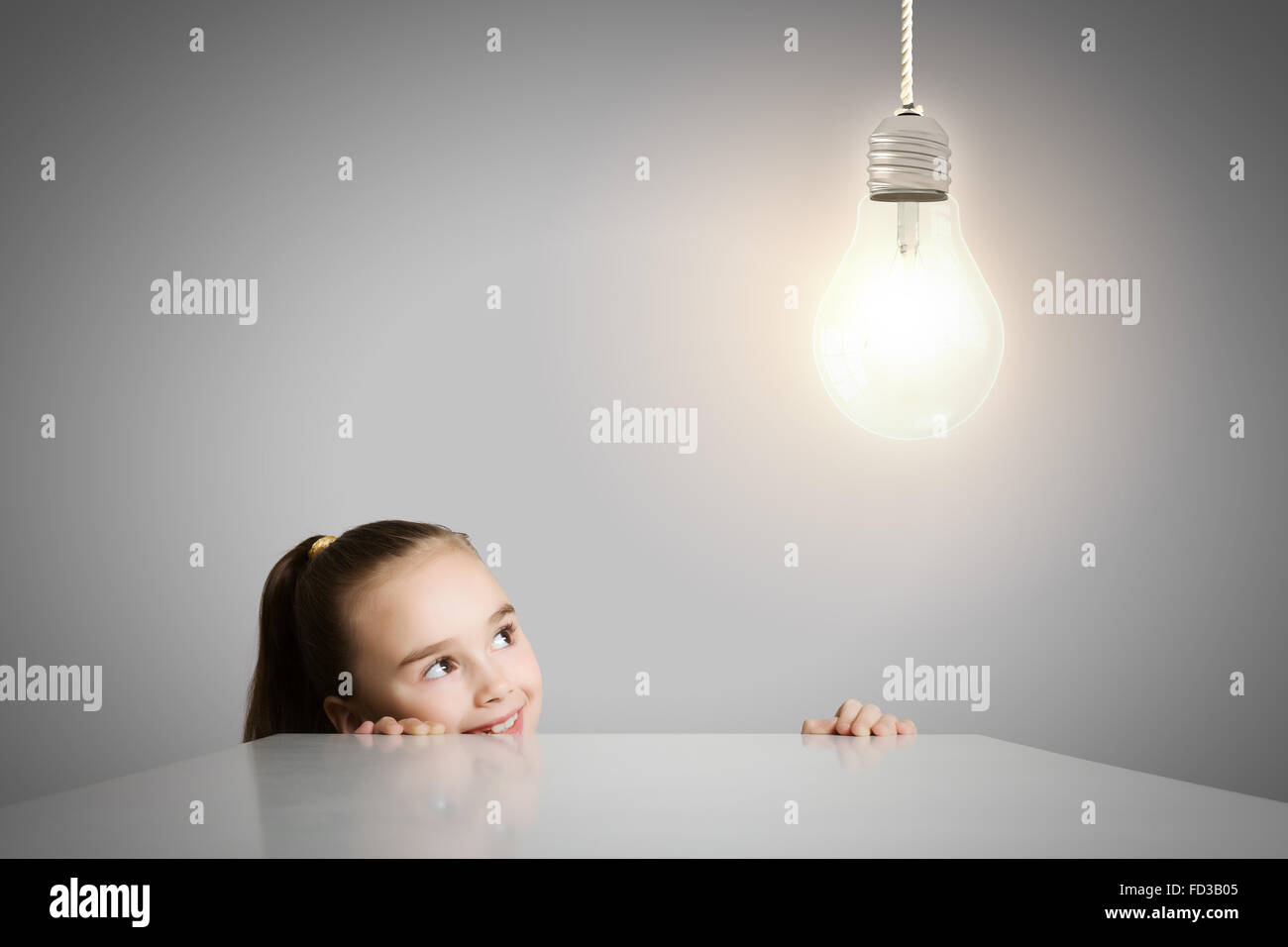 Little cute school girl and electric bulb Stock Photo - Alamy