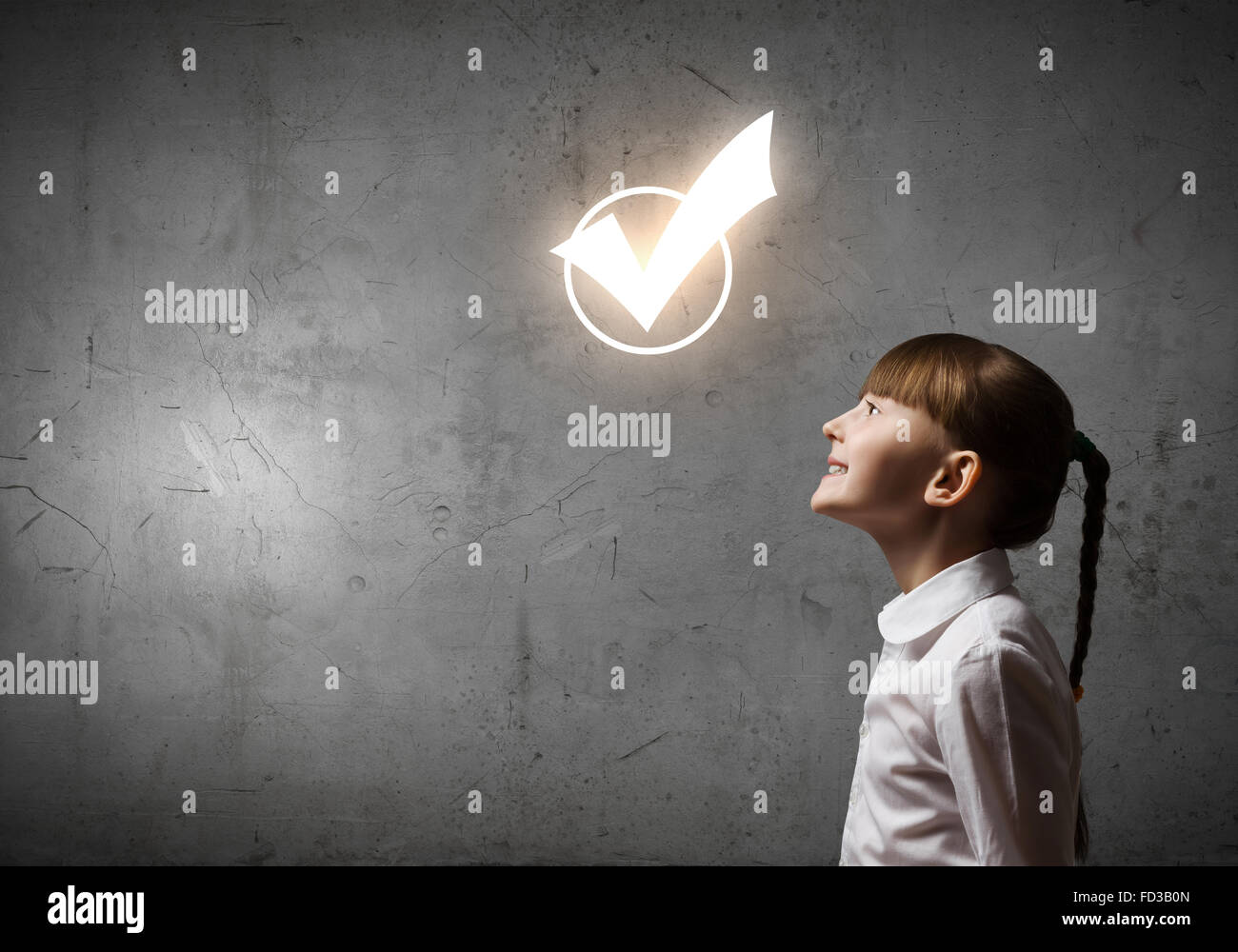 Side view of cute girl looking at tick Stock Photo - Alamy