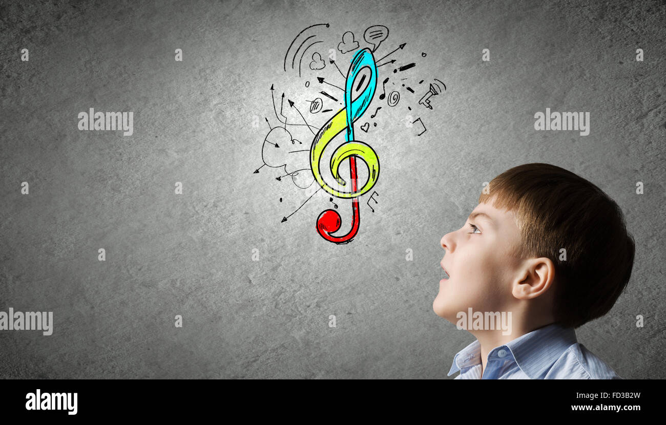 Colorful music symbol and cute boy singing Stock Photo - Alamy