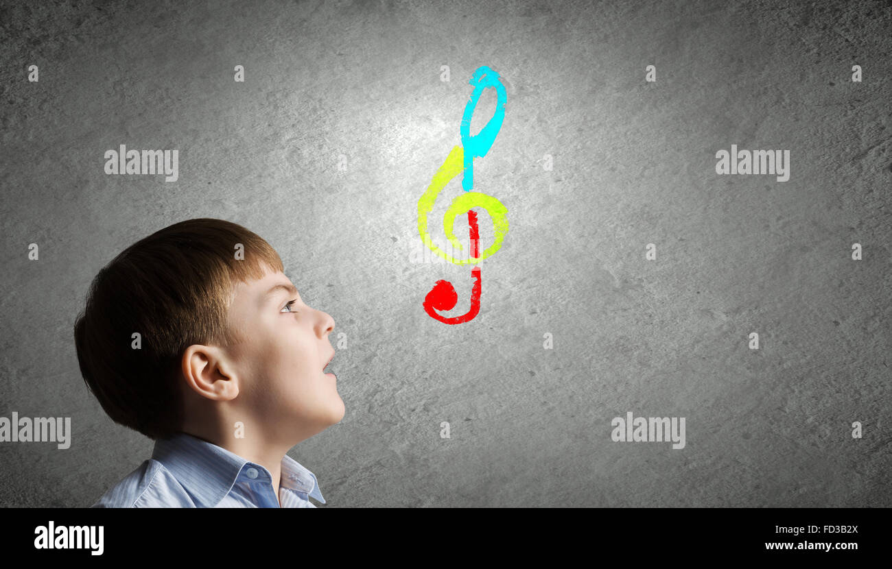 Colorful music symbol and cute boy singing Stock Photo - Alamy
