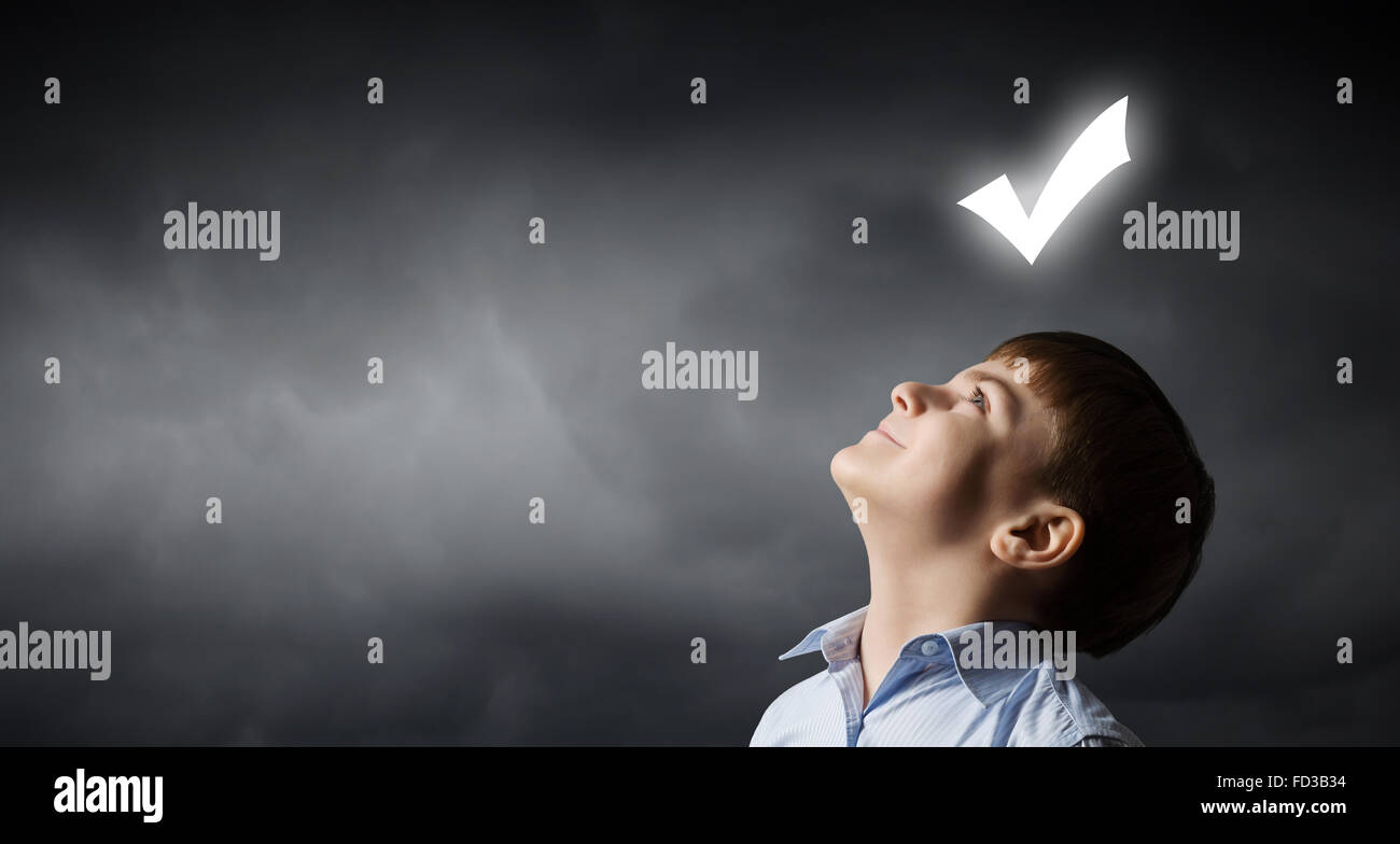 Cute boy looking at tick above his head Stock Photo - Alamy