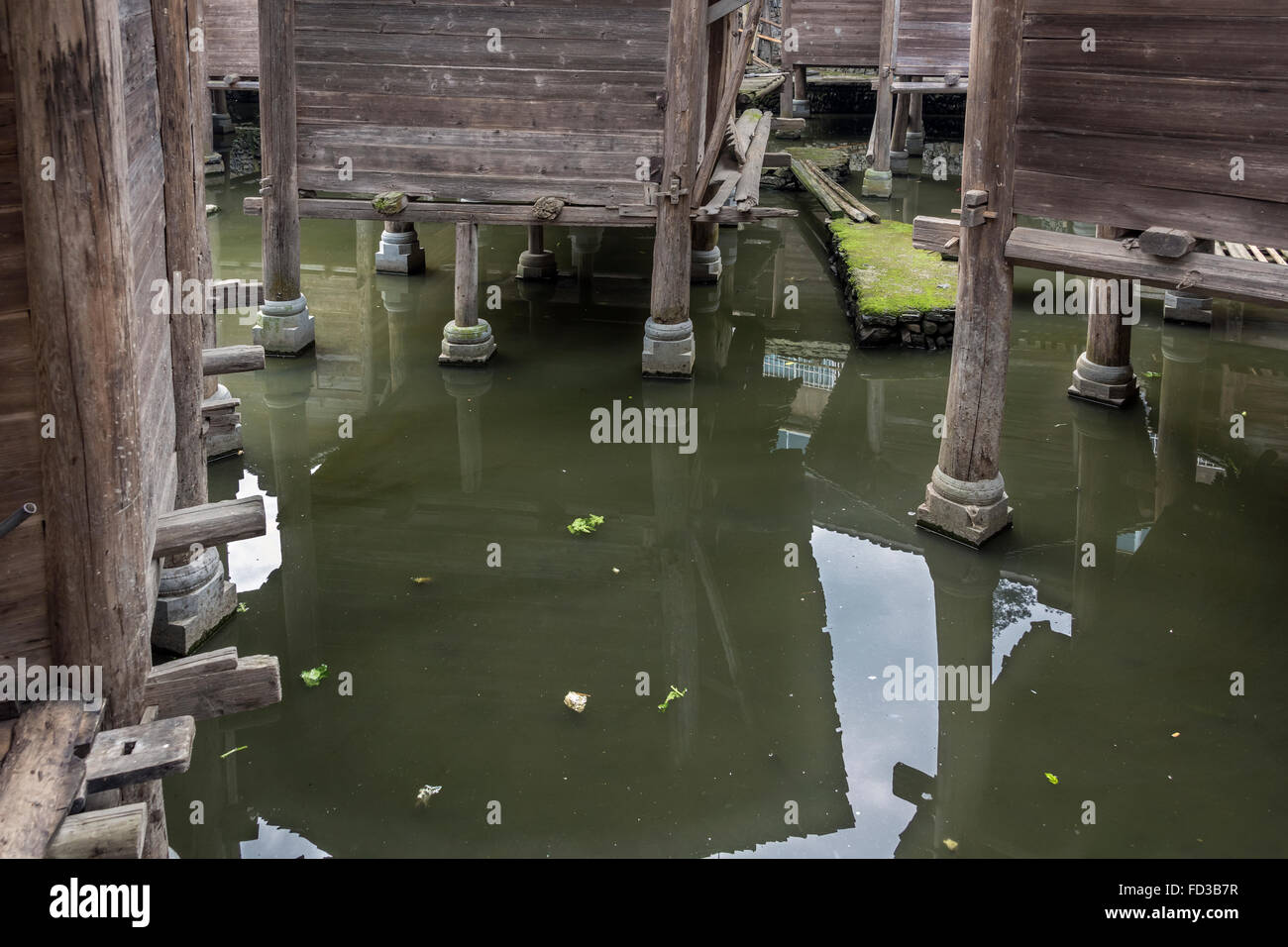 Elevated rice storage sheds with reflections, Datang Village, Guizhou ...