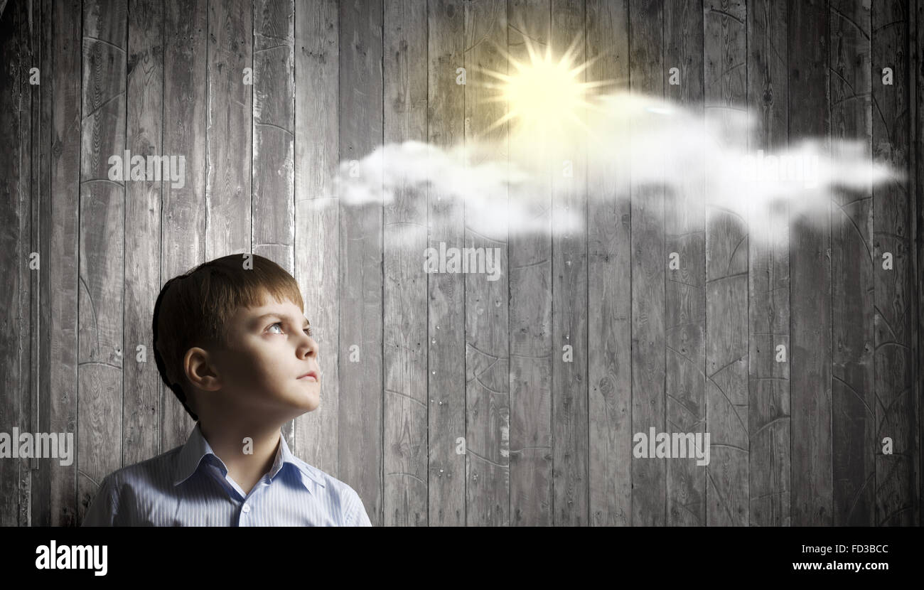 Young boy of school thinking about something Stock Photo - Alamy