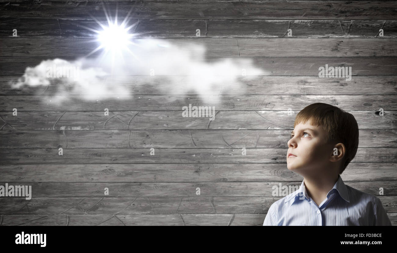 Young boy of school thinking about something Stock Photo - Alamy