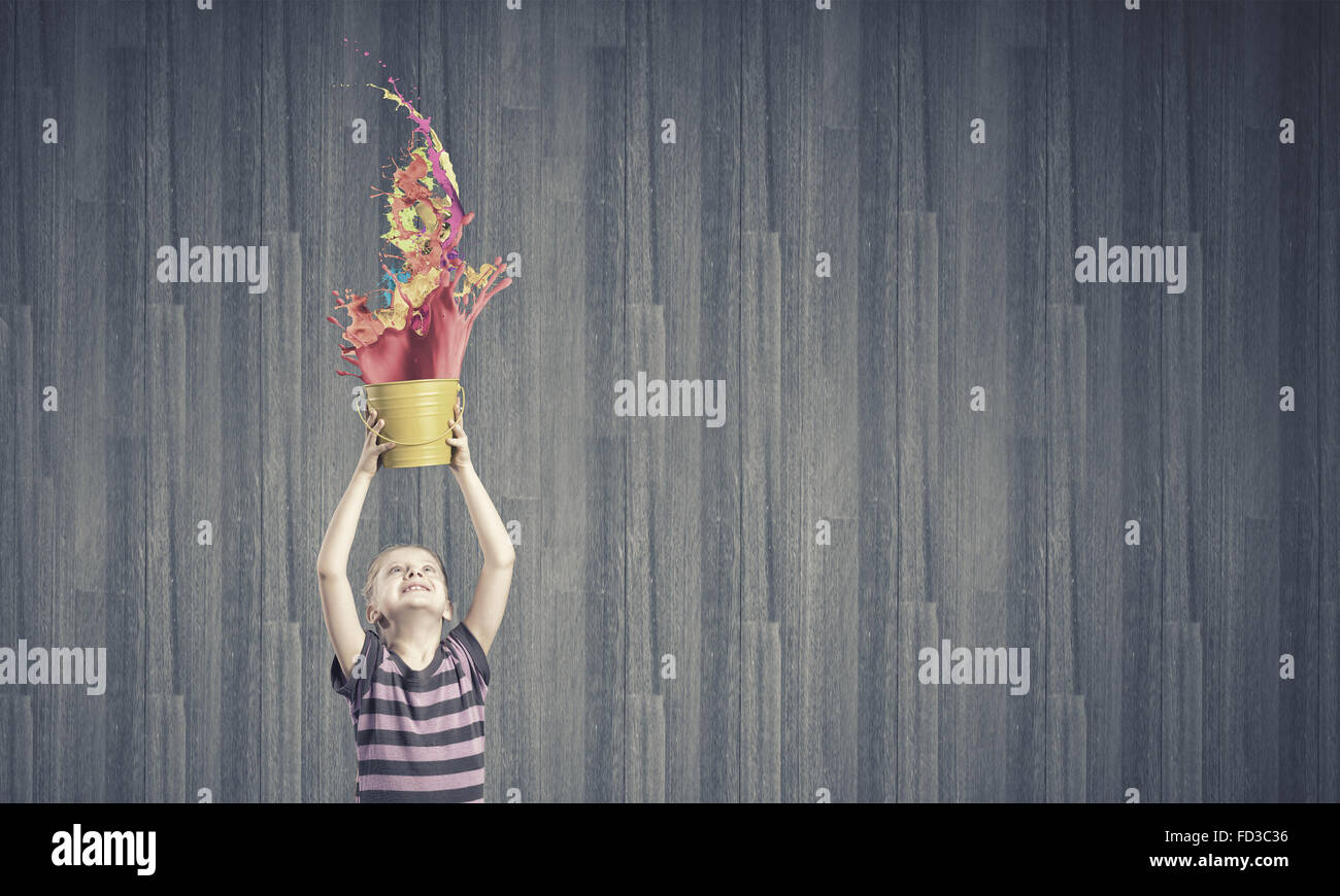 Cute girl with bucket and colorful springs coming out Stock Photo - Alamy