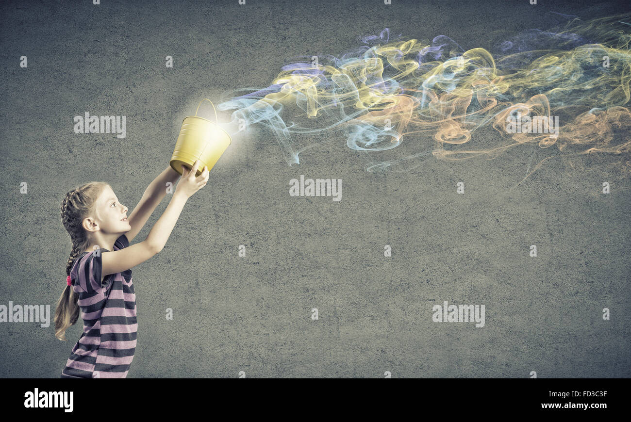 Cute girl with bucket and colorful springs coming out Stock Photo - Alamy