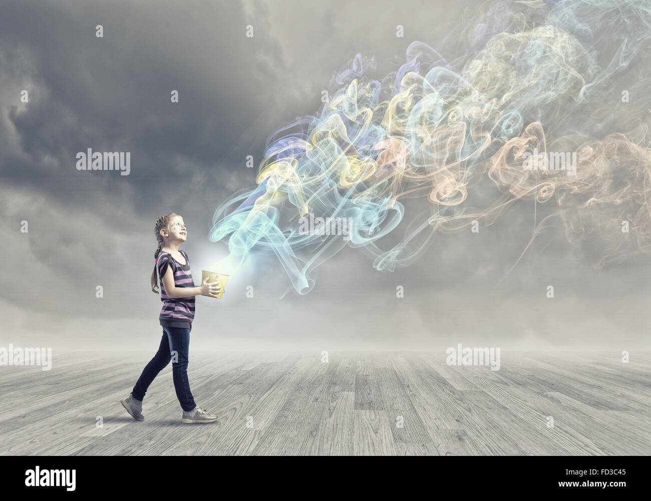 Cute girl with bucket and colorful springs coming out Stock Photo - Alamy