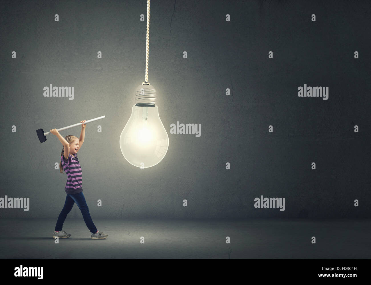 Cute little girl crushing light bulb with hammer Stock Photo - Alamy