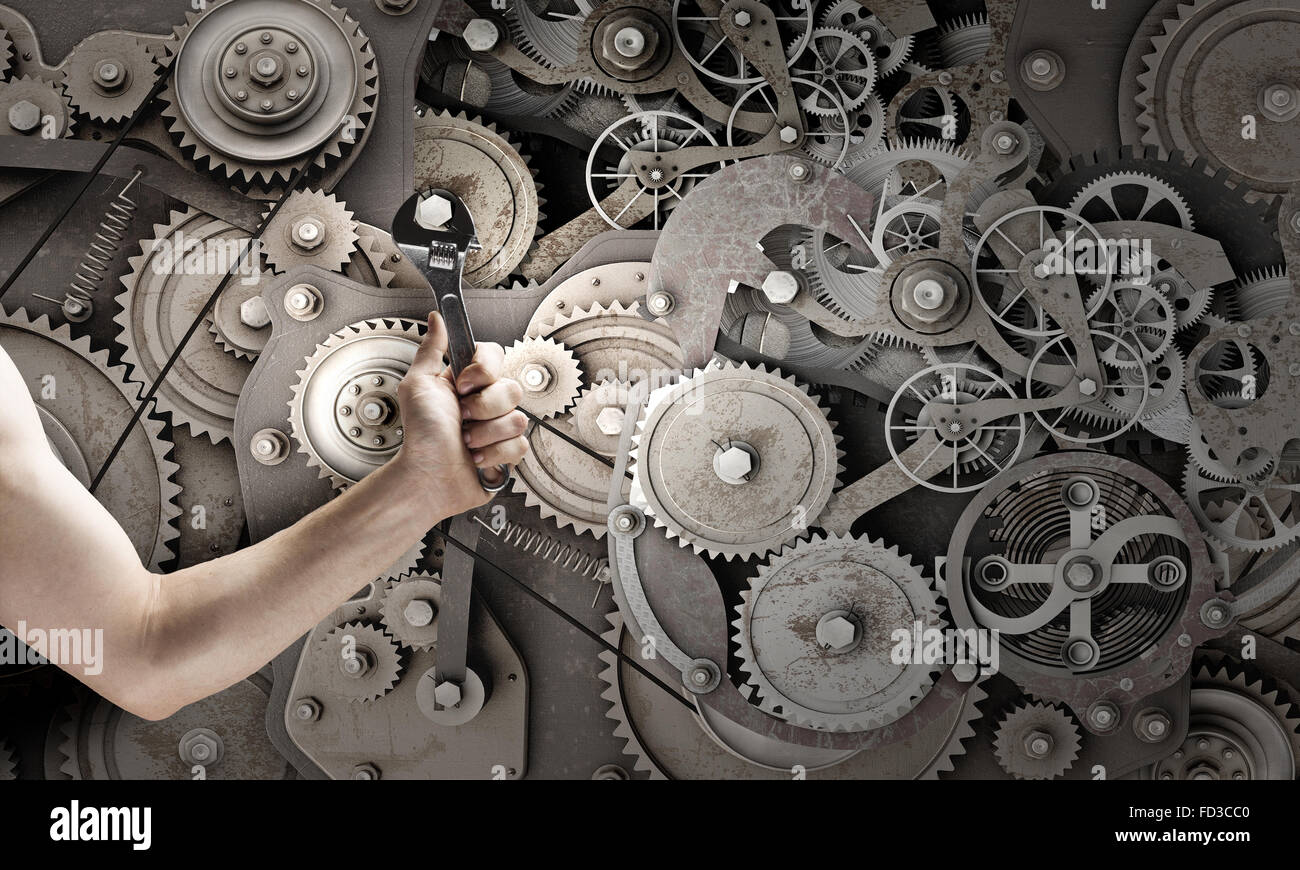 Close up of hand with wrench fixing mechanism Stock Photo - Alamy