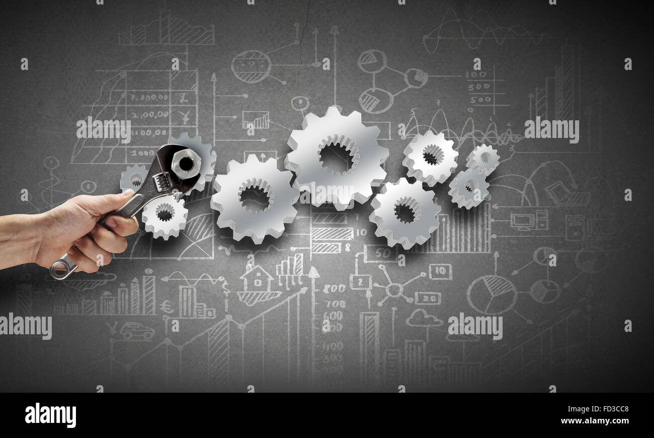 Close up of hand with wrench fixing mechanism Stock Photo - Alamy