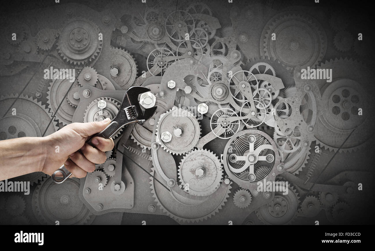 Close up of hand with wrench fixing mechanism Stock Photo - Alamy
