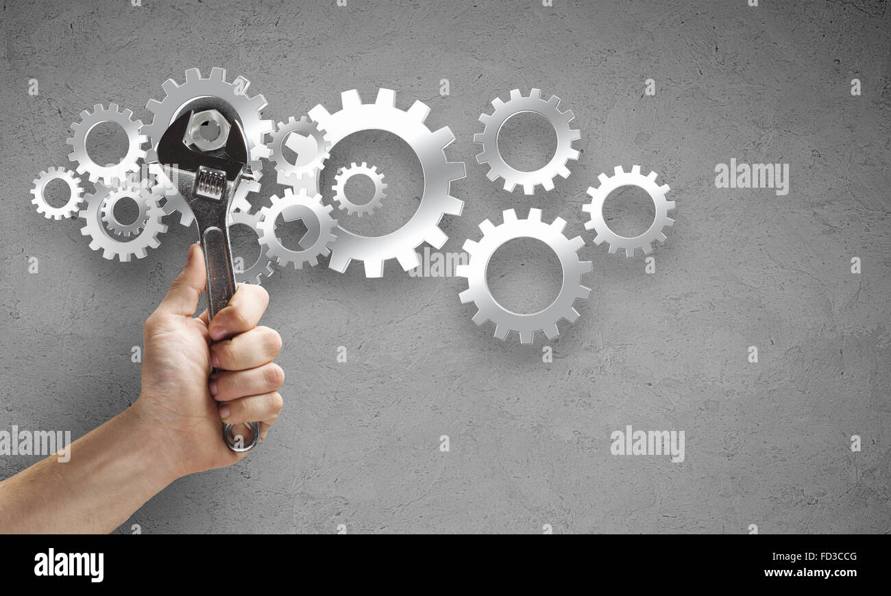 Close up of hand with wrench fixing mechanism Stock Photo - Alamy