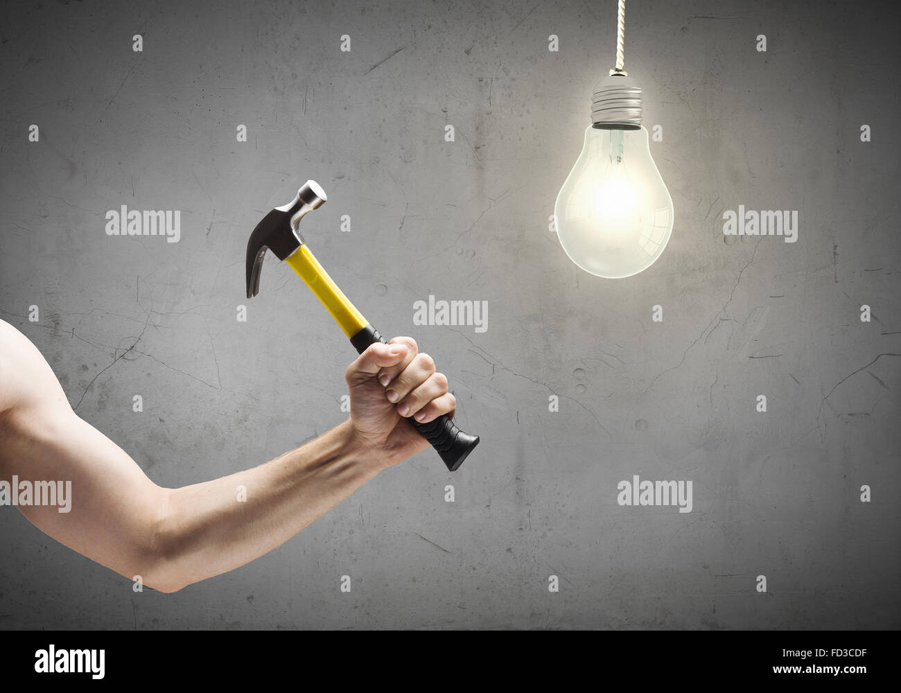 Close up of hammer in human hand hitting light bulb Stock Photo - Alamy