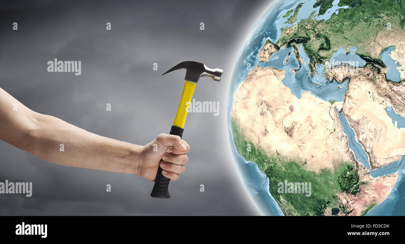 Close up of hammer in human hand hitting Earth planet. Elements of this ...