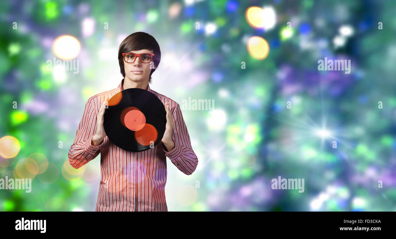 Young handsome man with disco plate in hands Stock Photo - Alamy