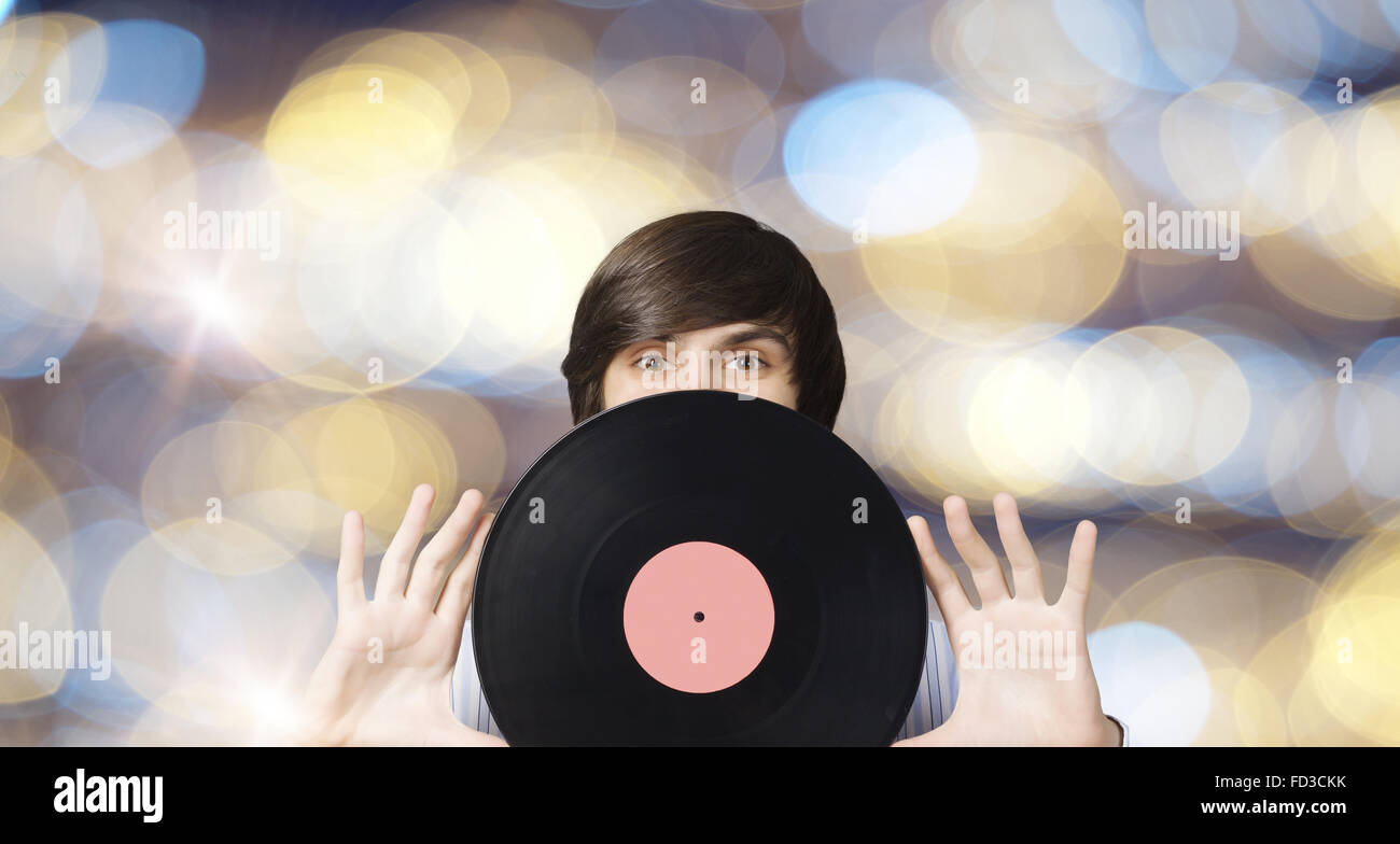 Young handsome man with disco plate in hands Stock Photo - Alamy