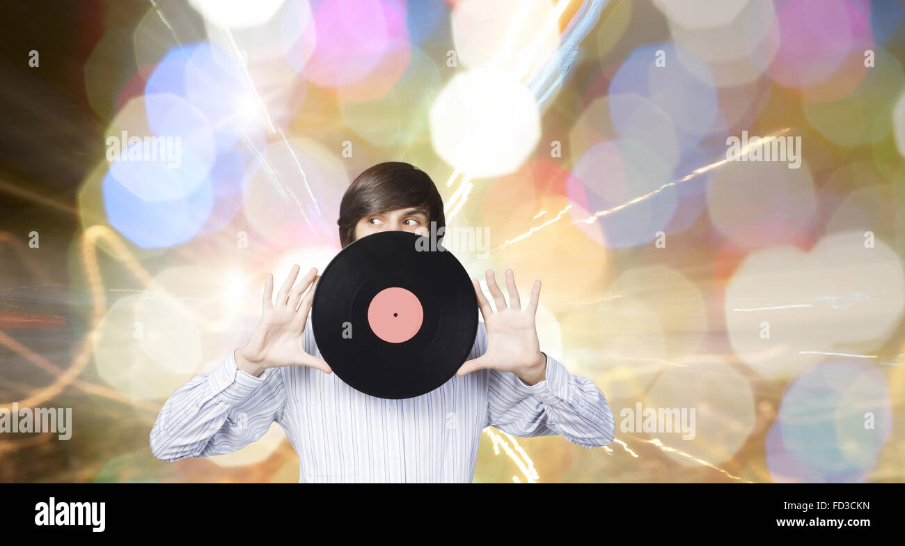 Young handsome man with disco plate in hands Stock Photo - Alamy