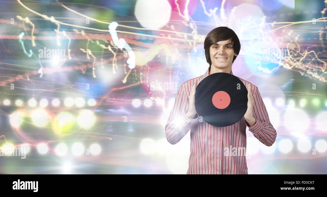 Young handsome man with disco plate in hands Stock Photo - Alamy