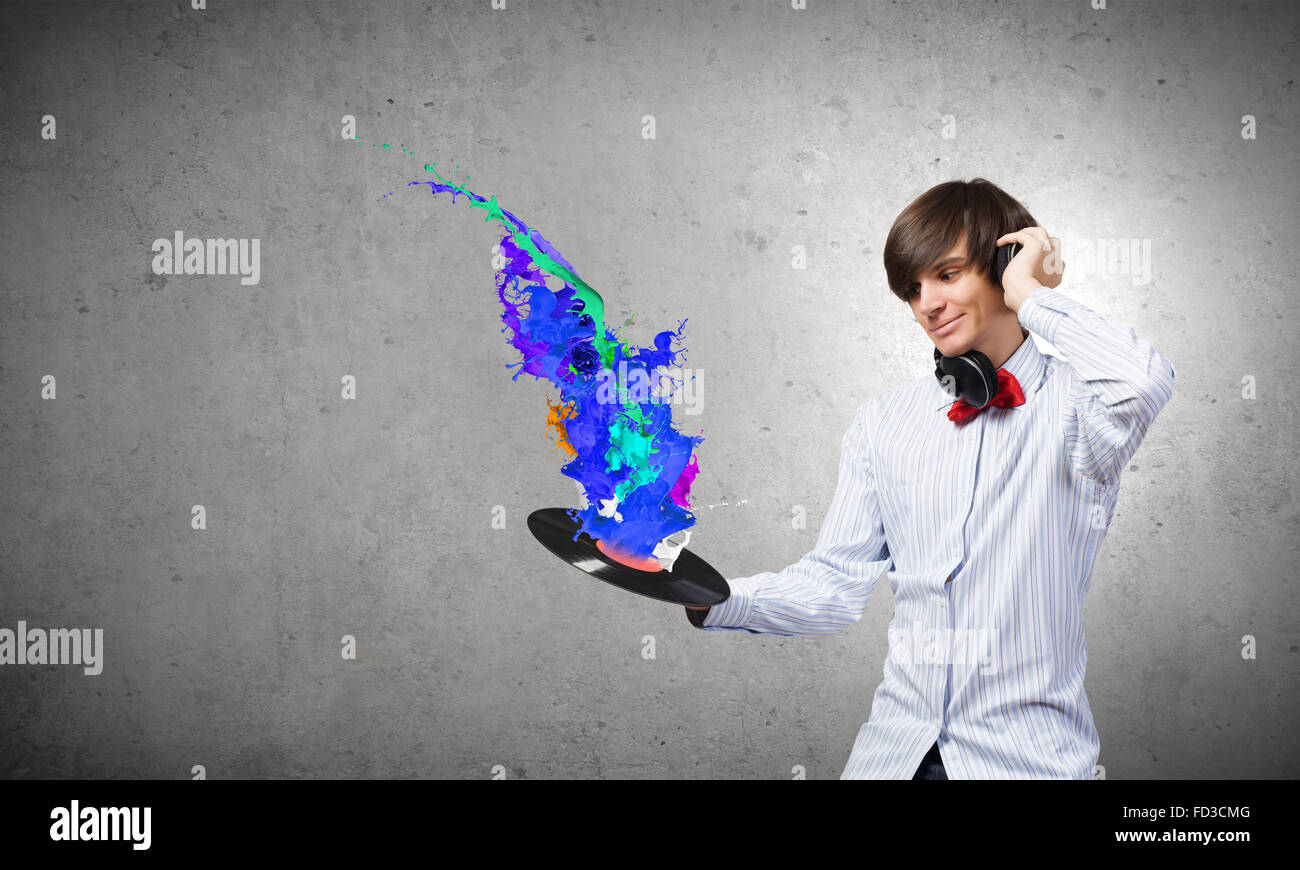 Young handsome man with disco plate in hands Stock Photo - Alamy