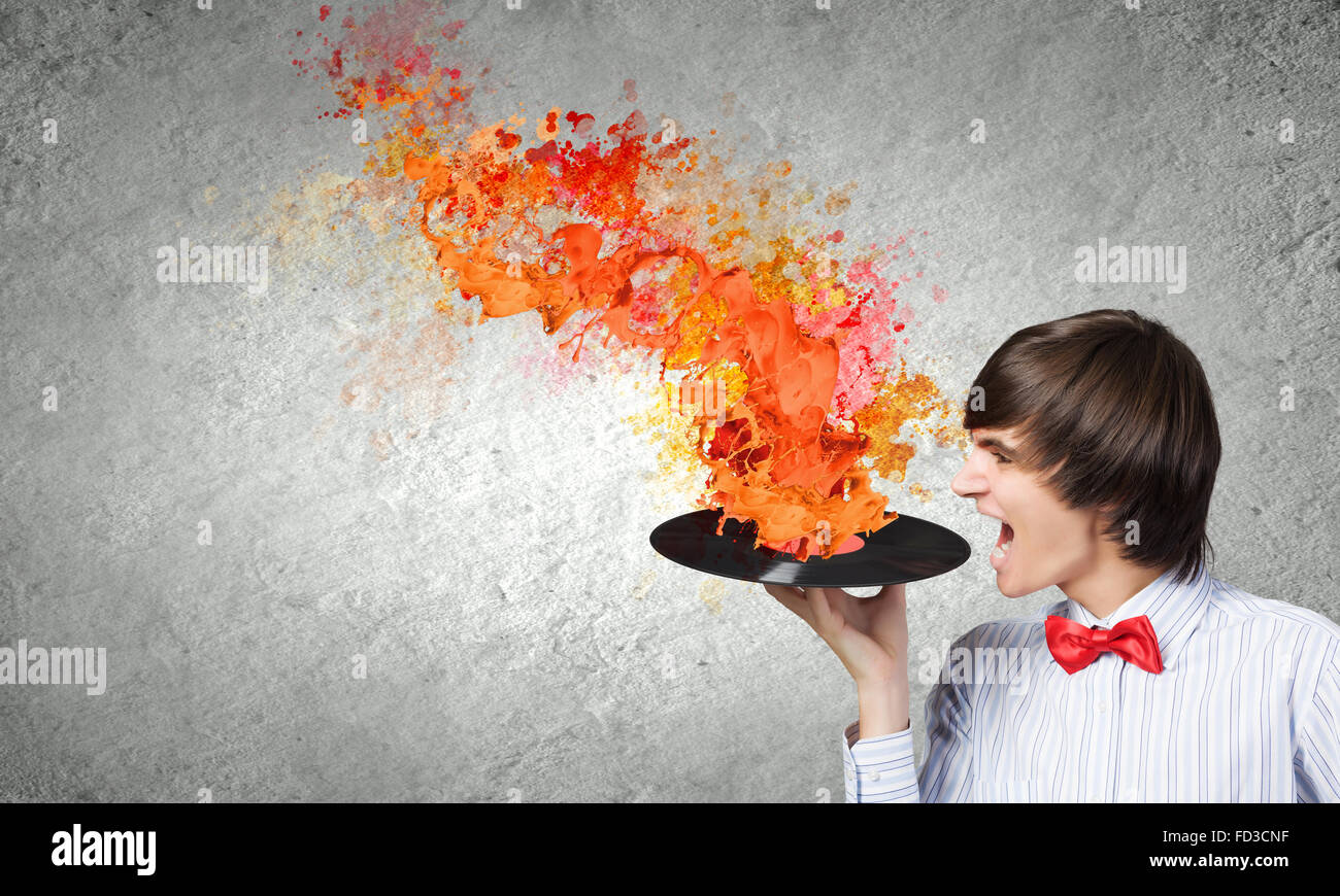 Young handsome man with disco plate in hands Stock Photo - Alamy