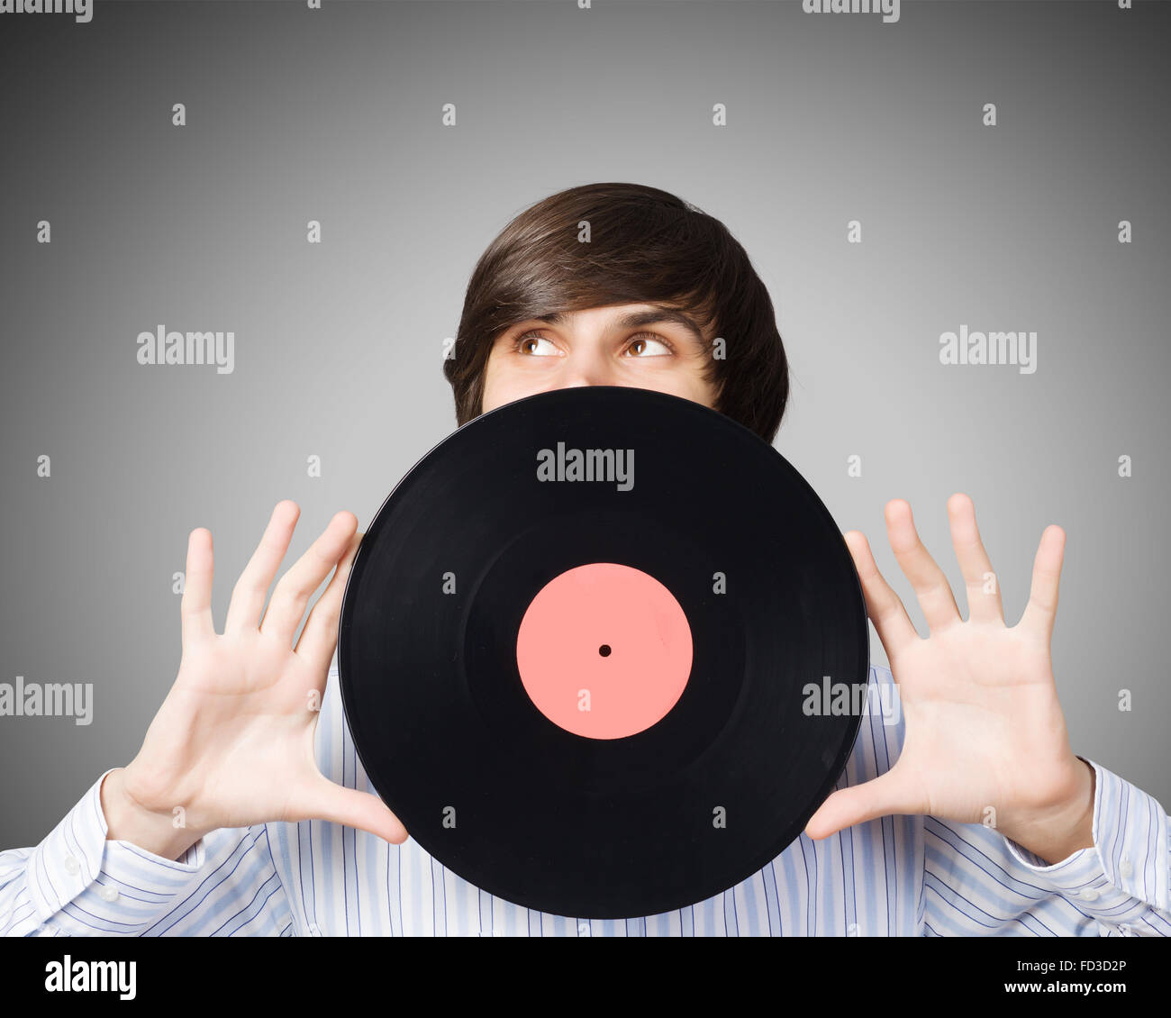 Young handsome man with disco plate in hands Stock Photo - Alamy