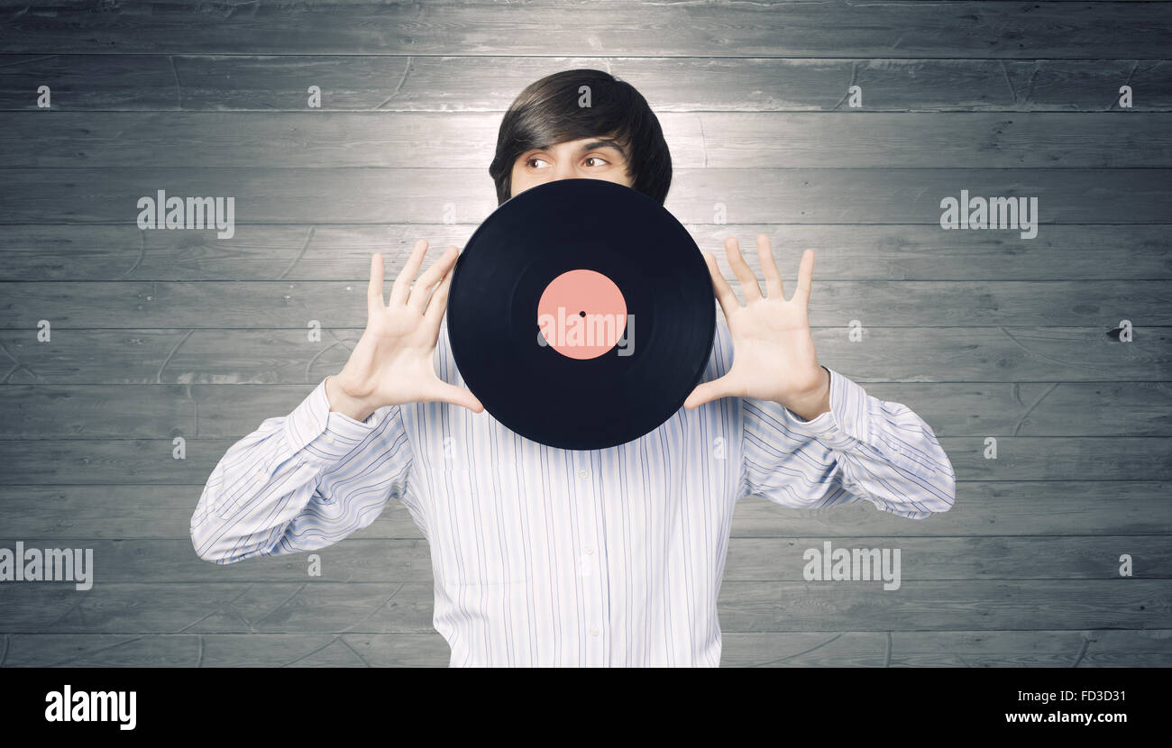 Young handsome man with disco plate in hands Stock Photo - Alamy