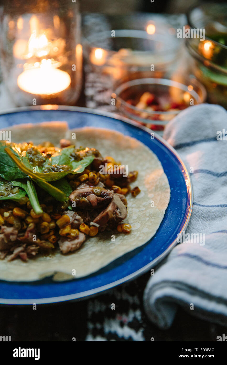 A fire cooked dinner is served at a campsite in Big Sur, California ...
