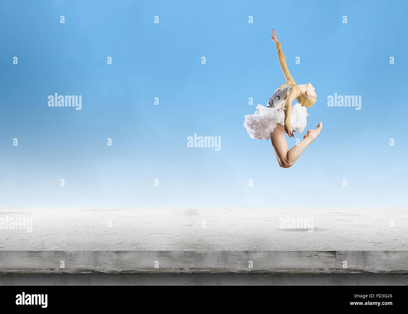 Young pretty ballerina girl making jump in dance Stock Photo - Alamy