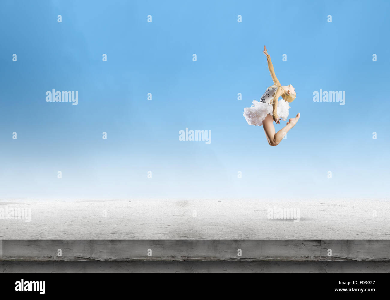 Young pretty ballerina girl making jump in dance Stock Photo - Alamy