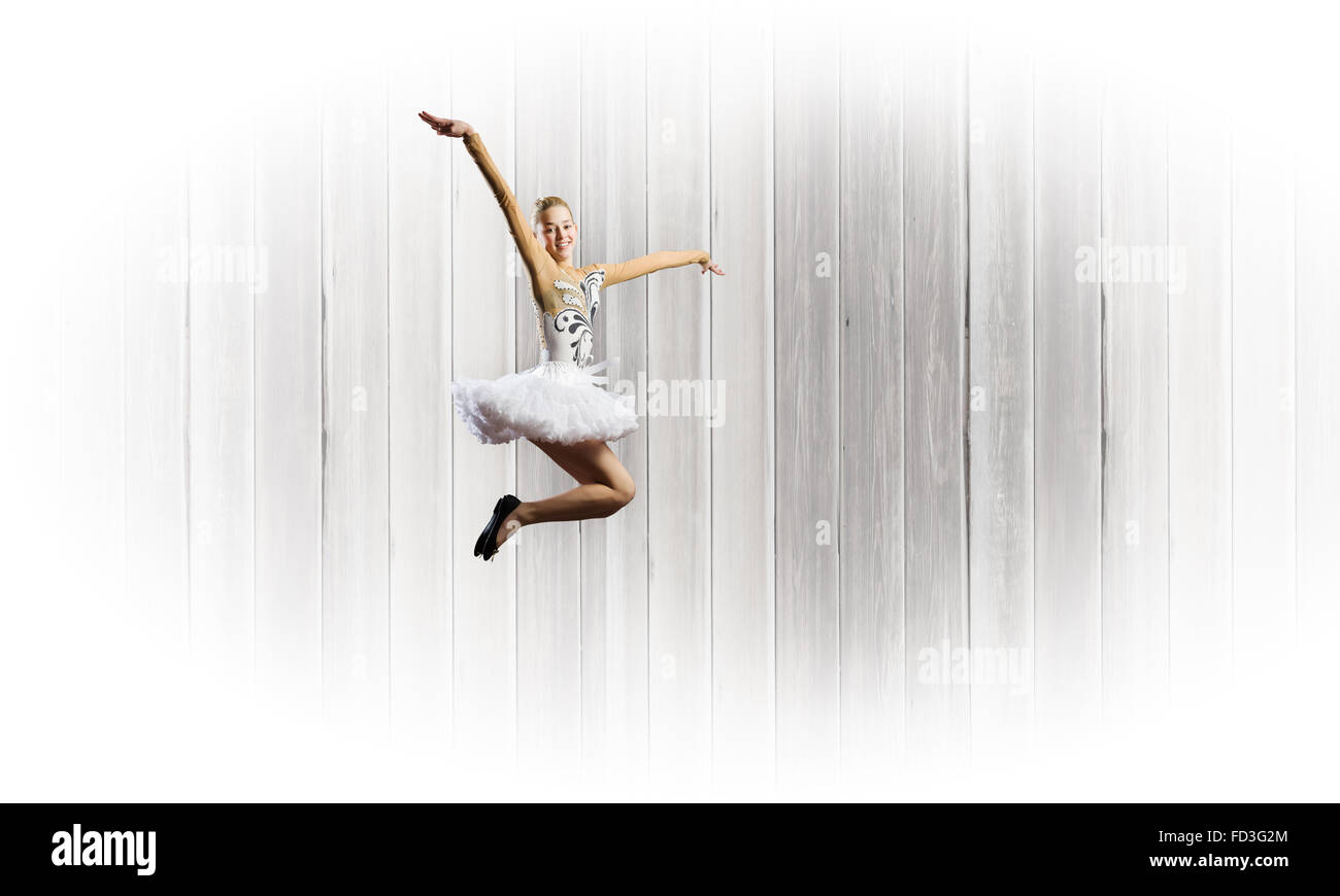 Young pretty ballerina girl making jump in dance Stock Photo - Alamy