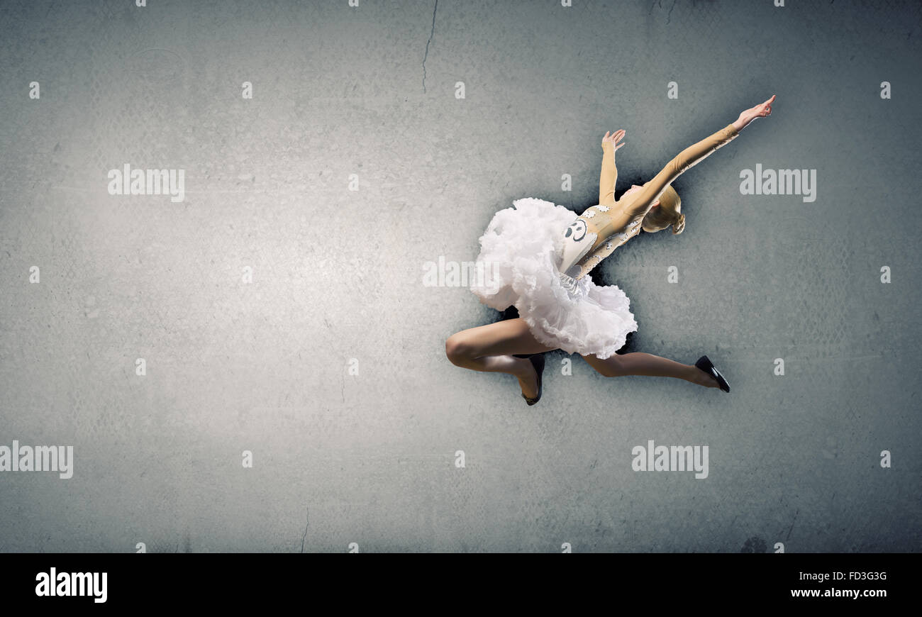 Young pretty ballerina girl making jump in dance Stock Photo - Alamy