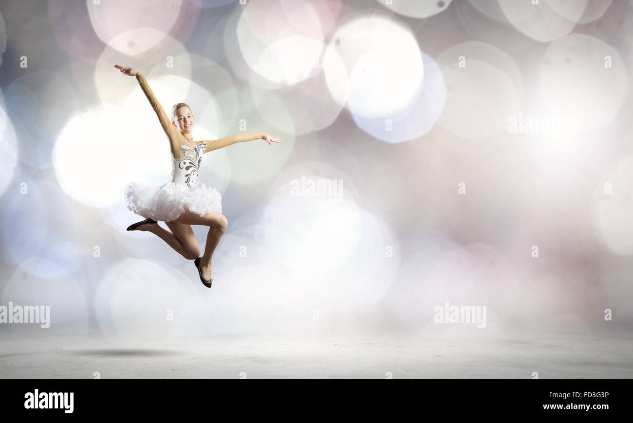 Young pretty ballerina girl making jump in dance Stock Photo - Alamy