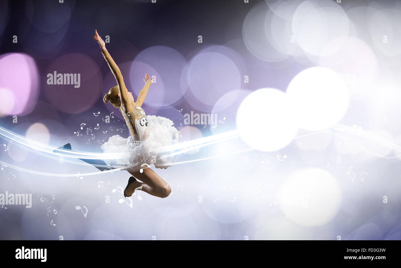 Young pretty ballerina girl making jump in dance Stock Photo - Alamy