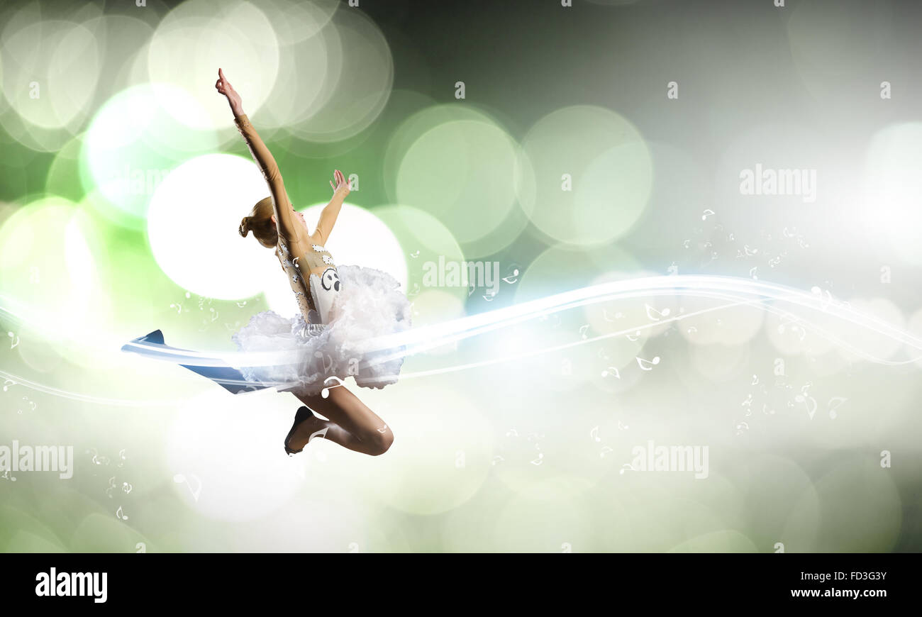Young pretty ballerina girl making jump in dance Stock Photo - Alamy