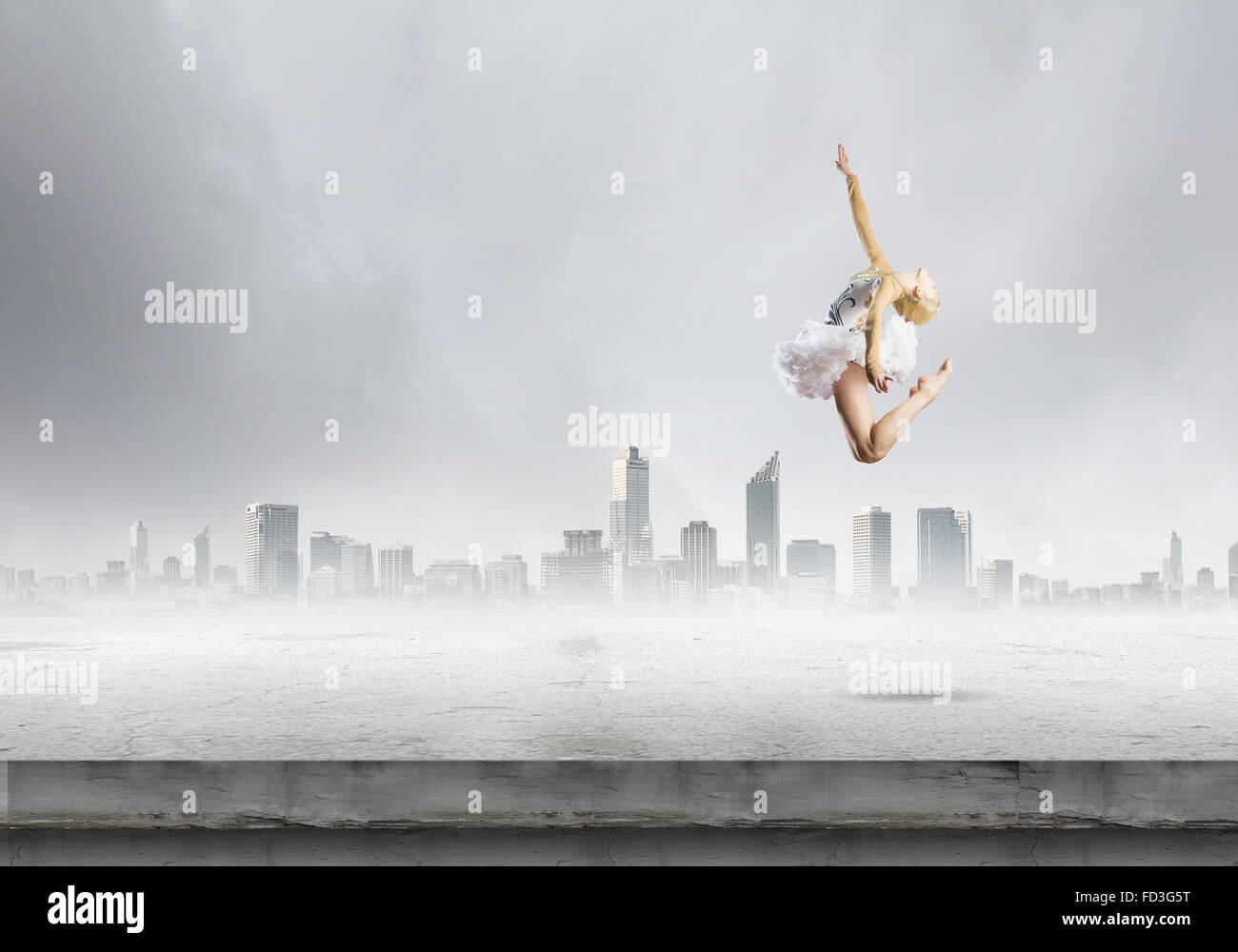 Young pretty ballerina girl making jump in dance Stock Photo - Alamy