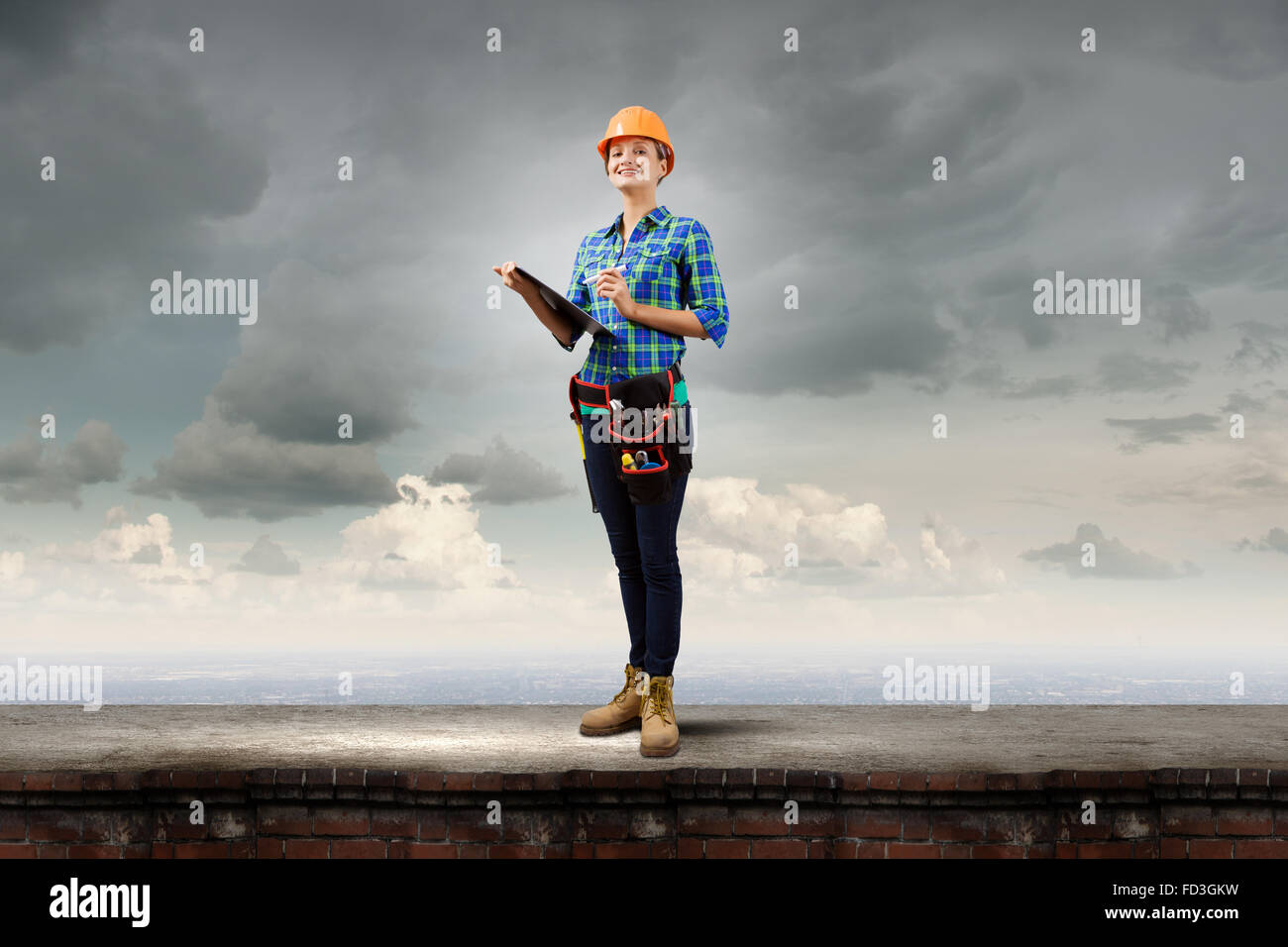 Attractive woman engineer making some notes and sketches Stock Photo ...