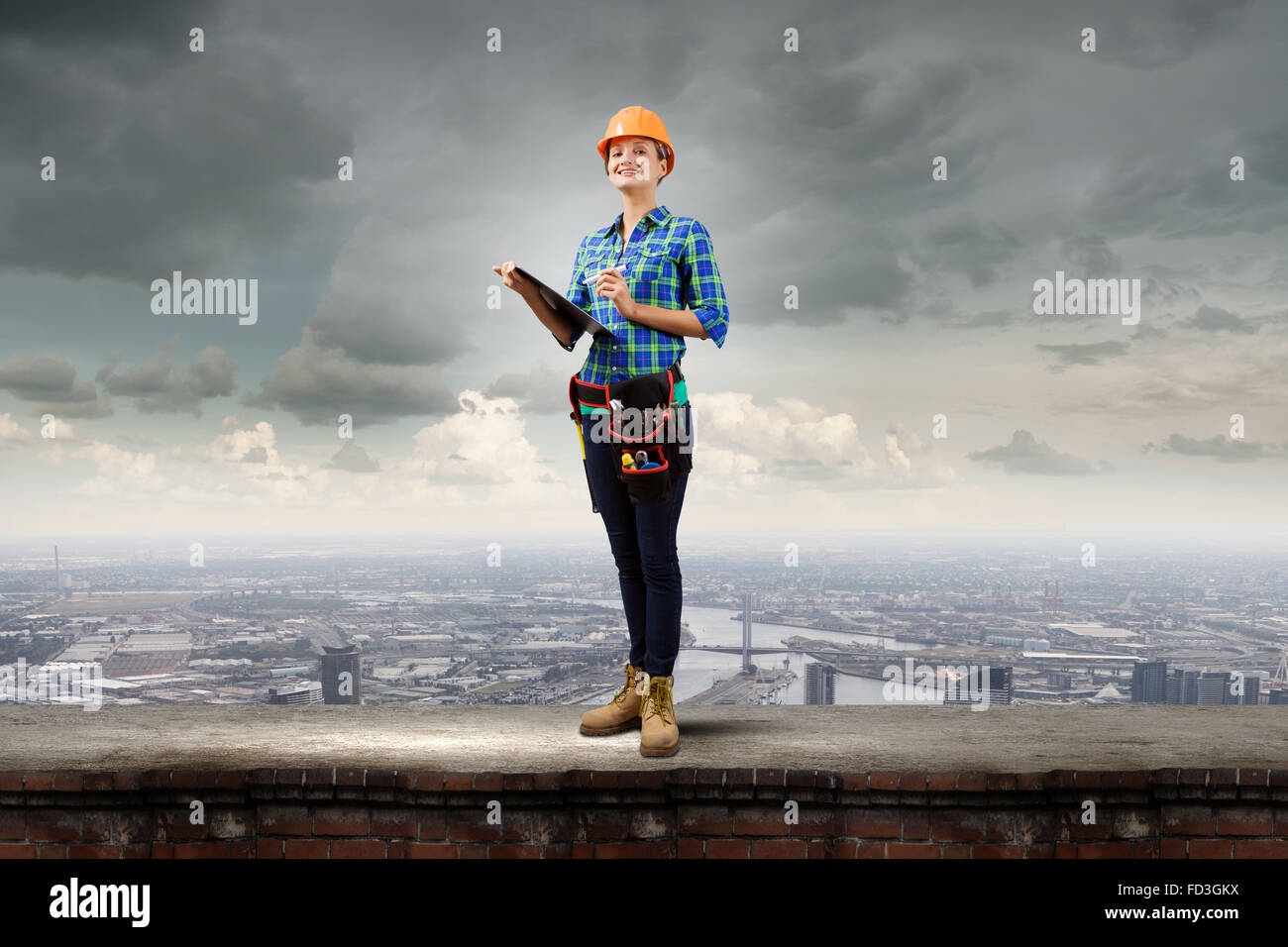 Attractive woman engineer making some notes and sketches Stock Photo ...