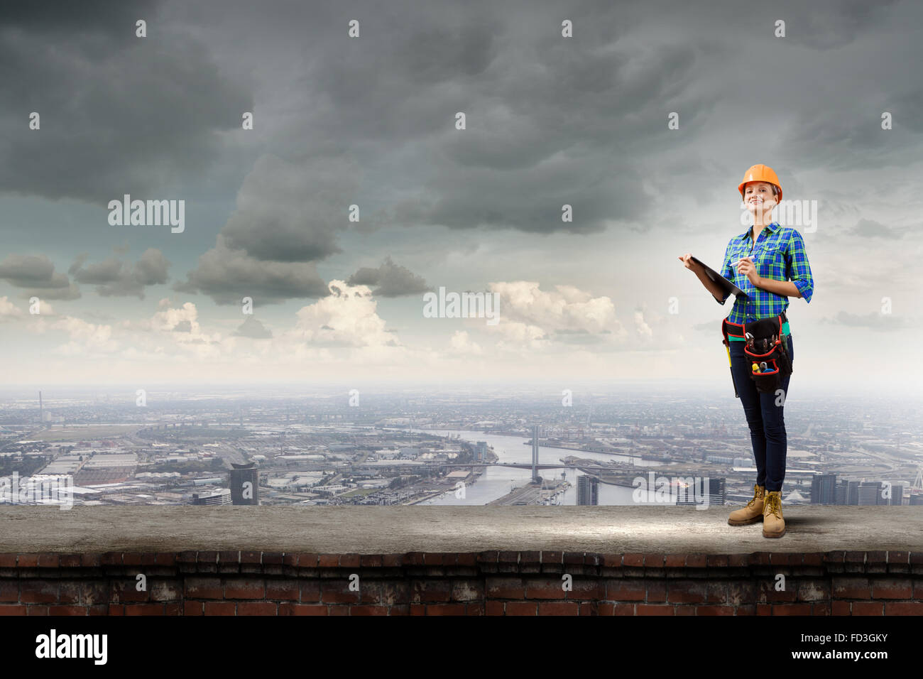 Attractive woman engineer making some notes and sketches Stock Photo ...