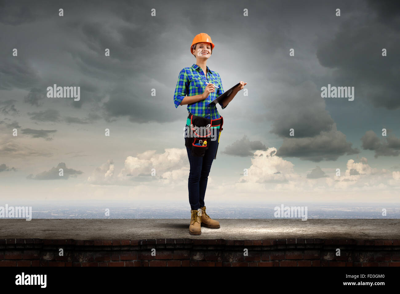 Attractive woman engineer making some notes and sketches Stock Photo ...