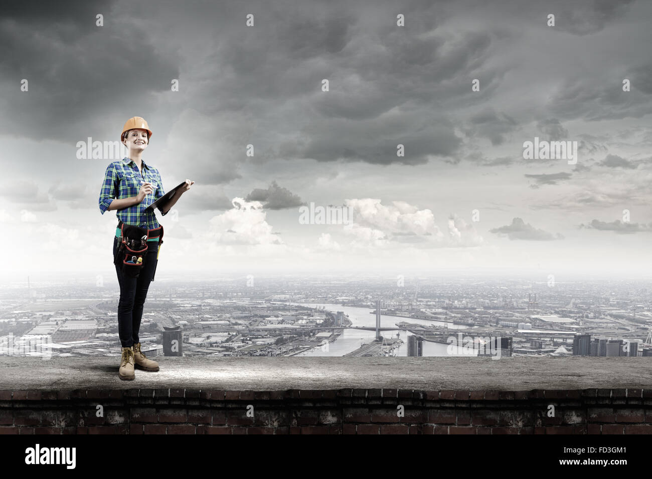 Attractive woman engineer making some notes and sketches Stock Photo ...