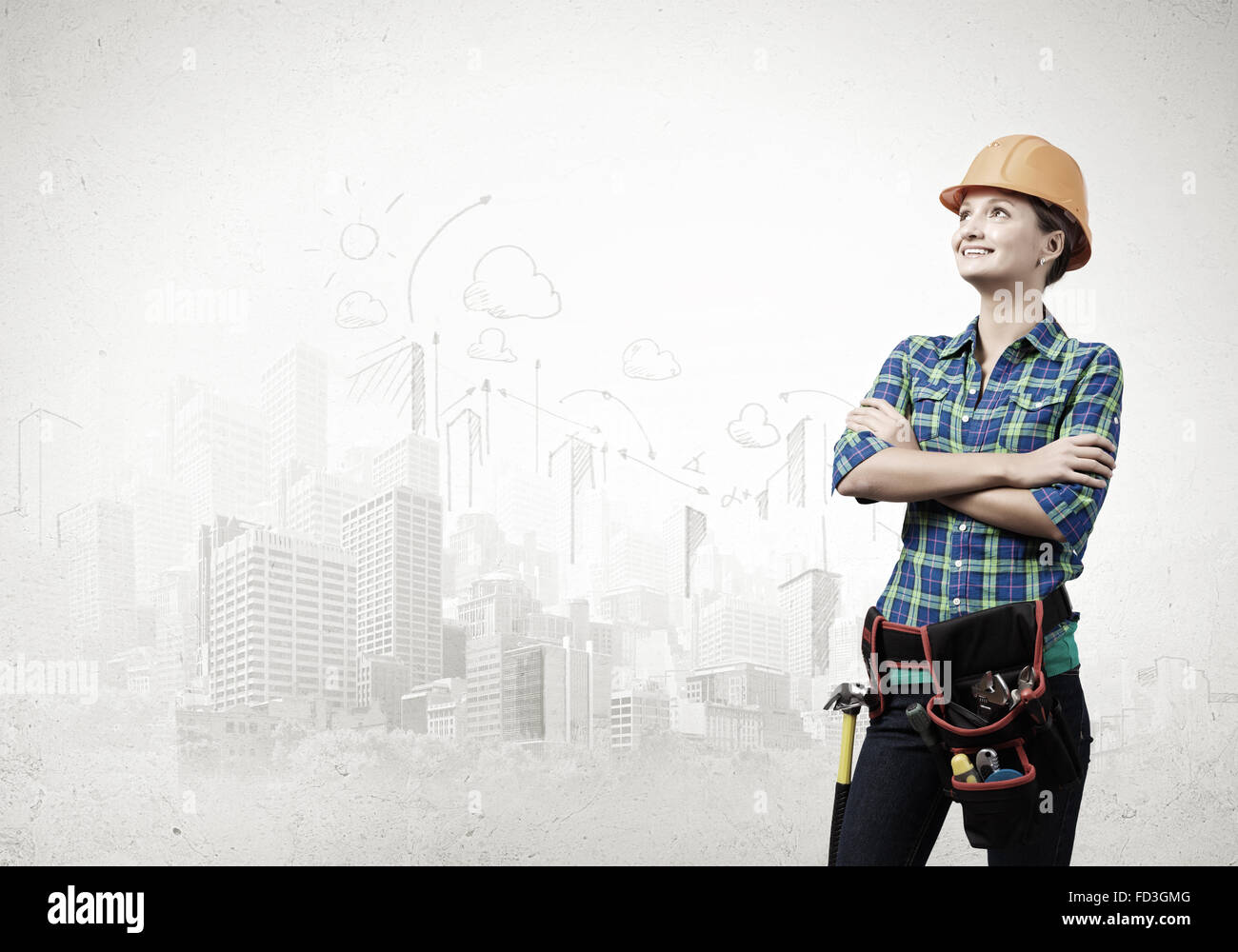 Attractive smiling woman engineer wearing helmet and tool belt Stock ...