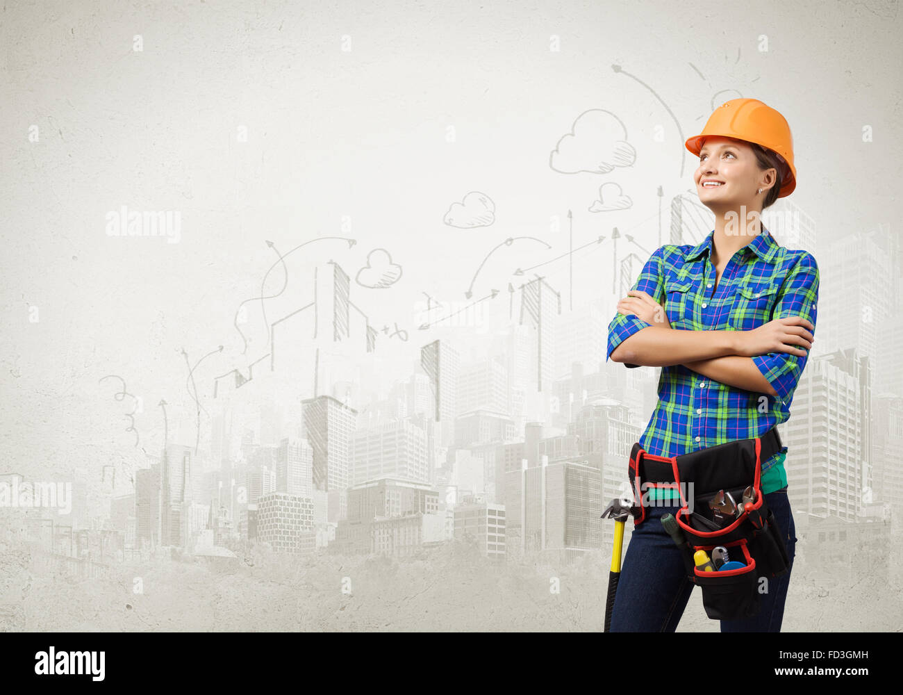 Attractive smiling woman engineer wearing helmet and tool belt Stock ...