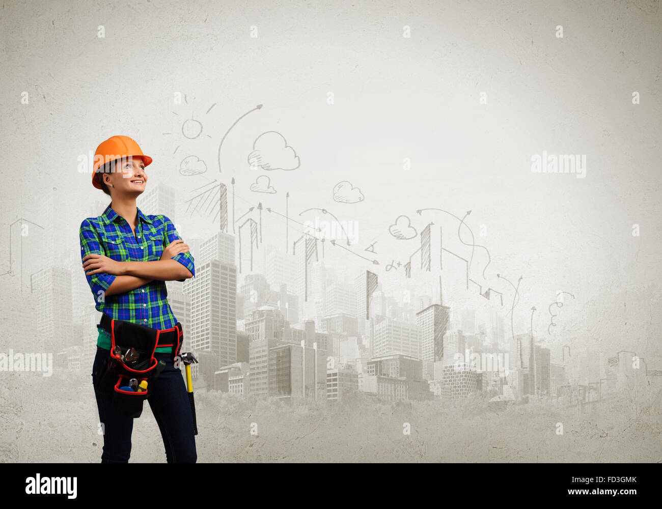 Attractive smiling woman engineer wearing helmet and tool belt Stock ...