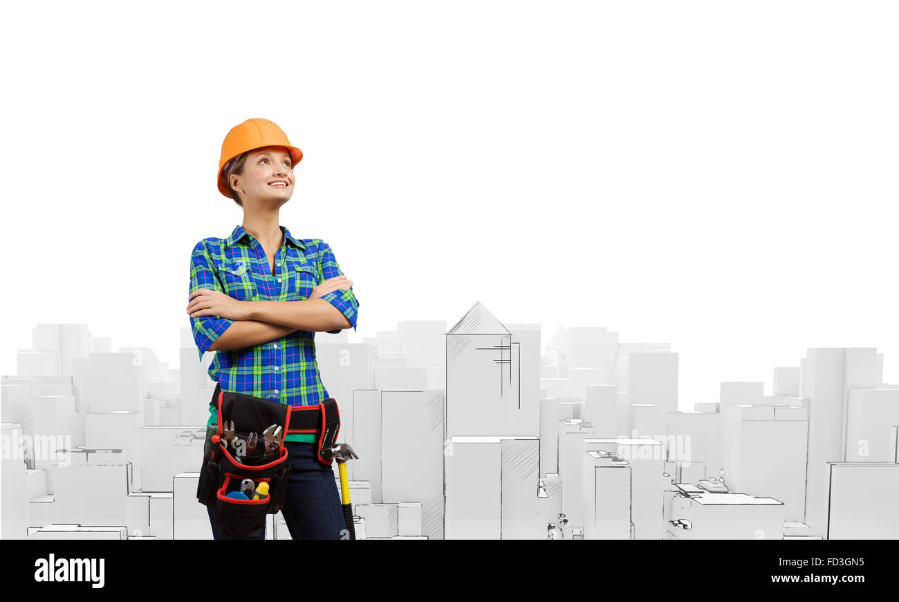 Attractive smiling woman engineer wearing helmet and tool belt Stock ...