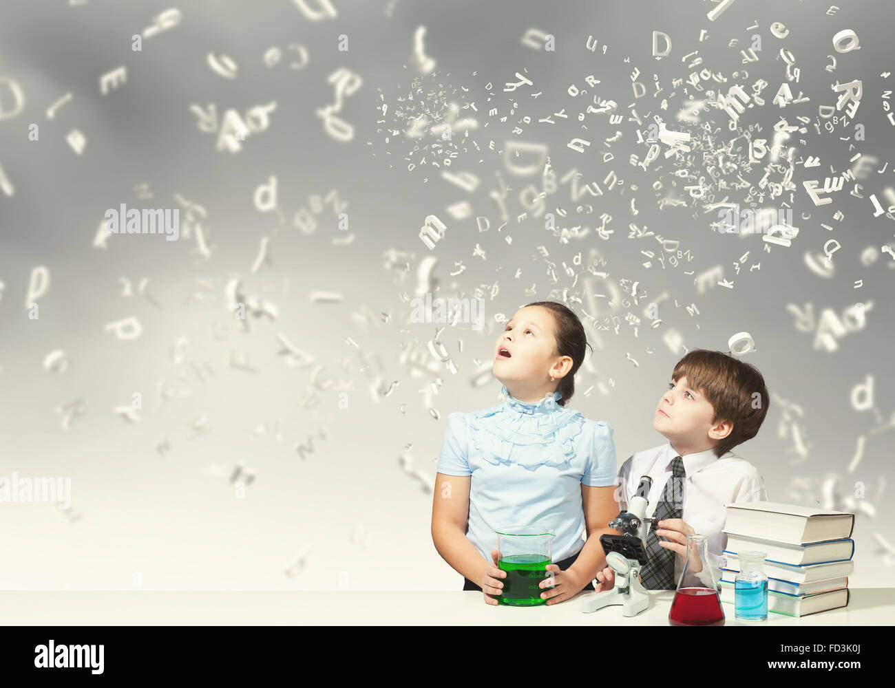 Cute girl and boy at chemistry lesson making tests Stock Photo - Alamy