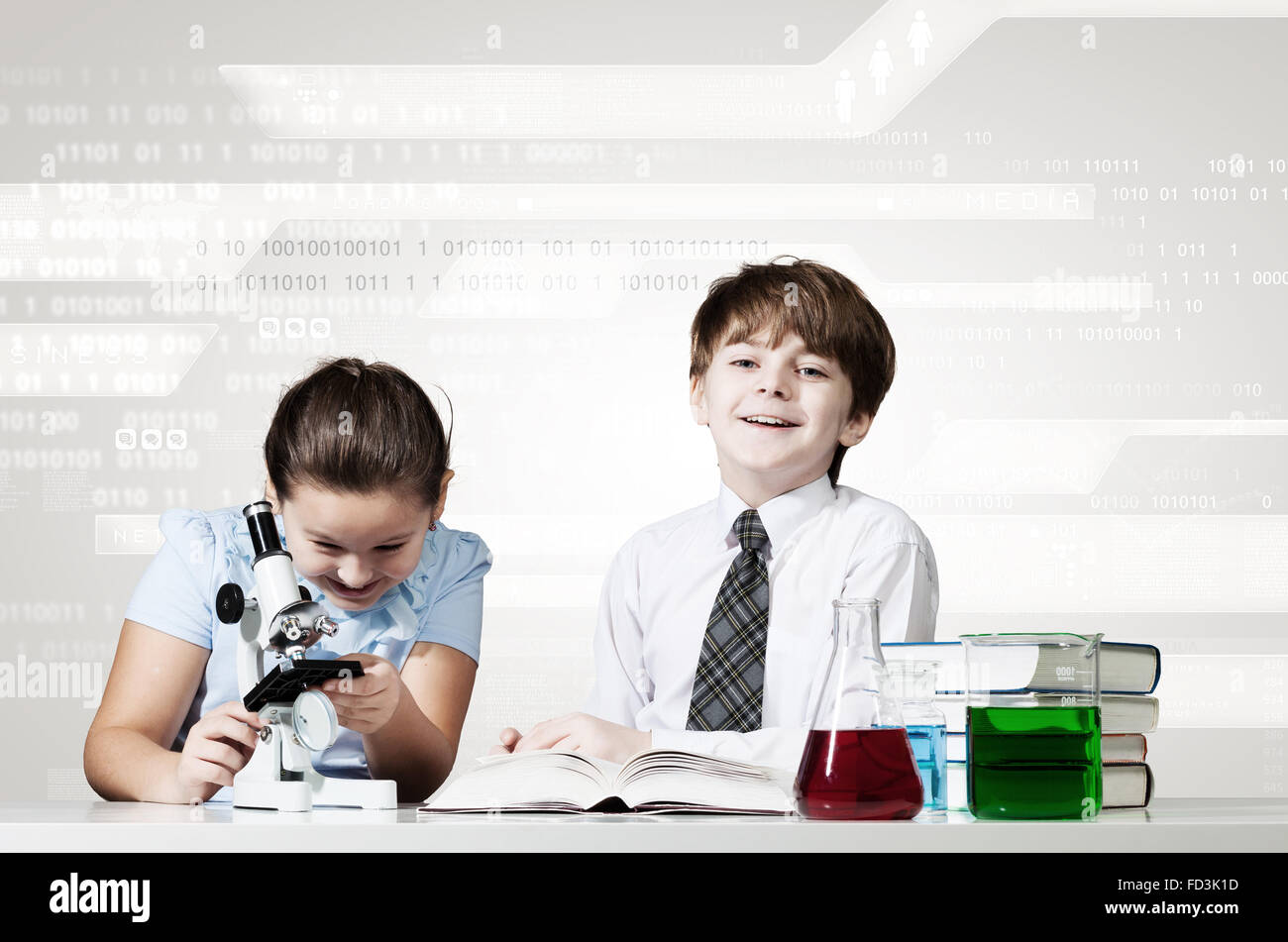 Cute girl and boy at chemistry lesson making tests Stock Photo - Alamy