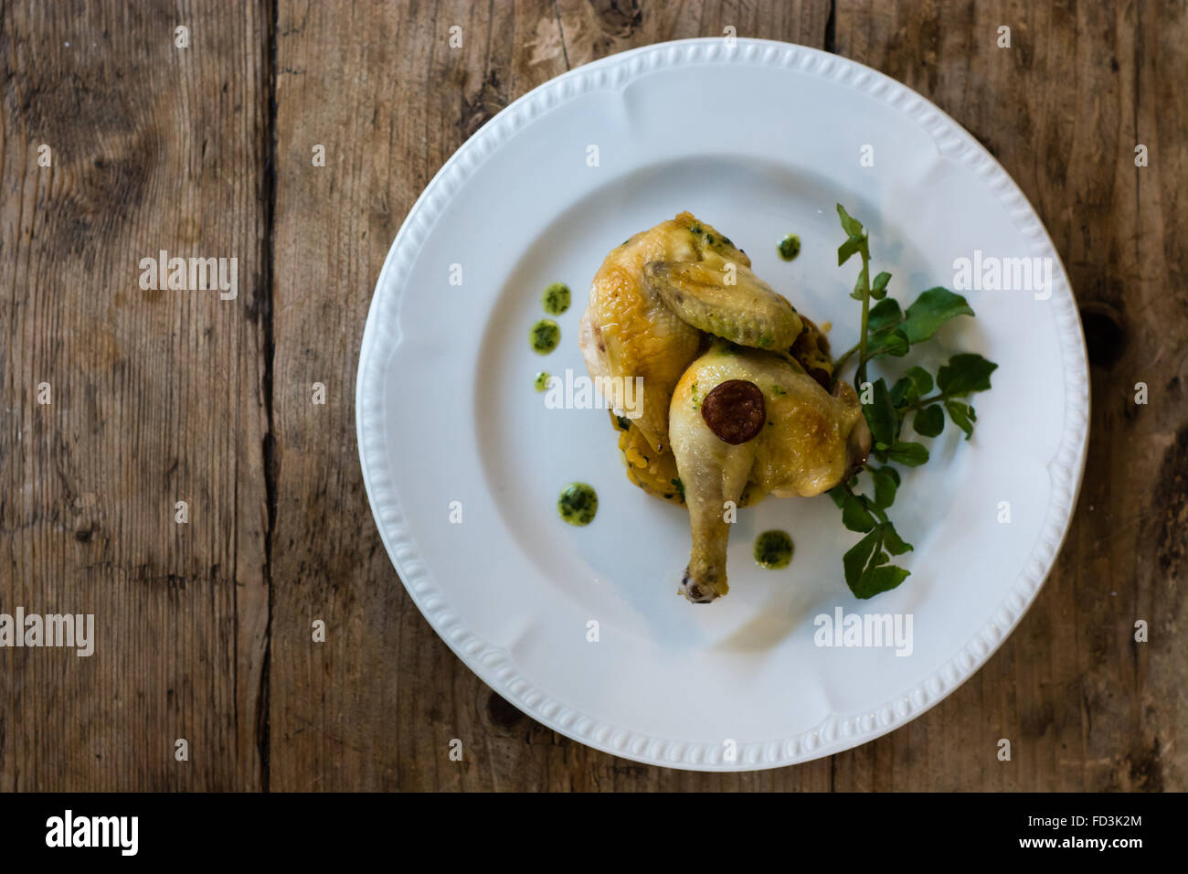 Roast poussin, crushed potato and chorizo with herb butter from above ...