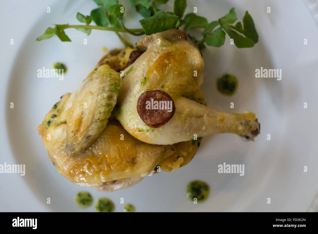 Roast poussin, crushed potato and chorizo with herb butter from above ...