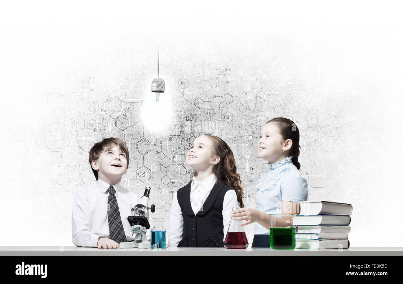 Cute girl and boy at chemistry lesson making tests Stock Photo - Alamy